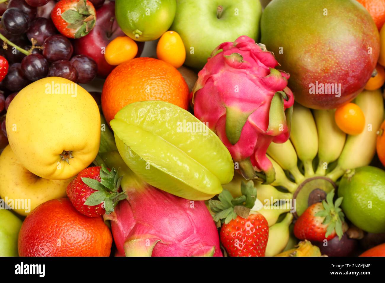 Assortment of fresh exotic fruits as background, top view Stock Photo ...