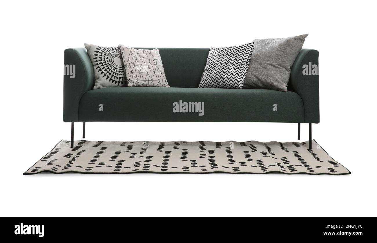 Comfortable green sofa with cushions and carpet on white background ...