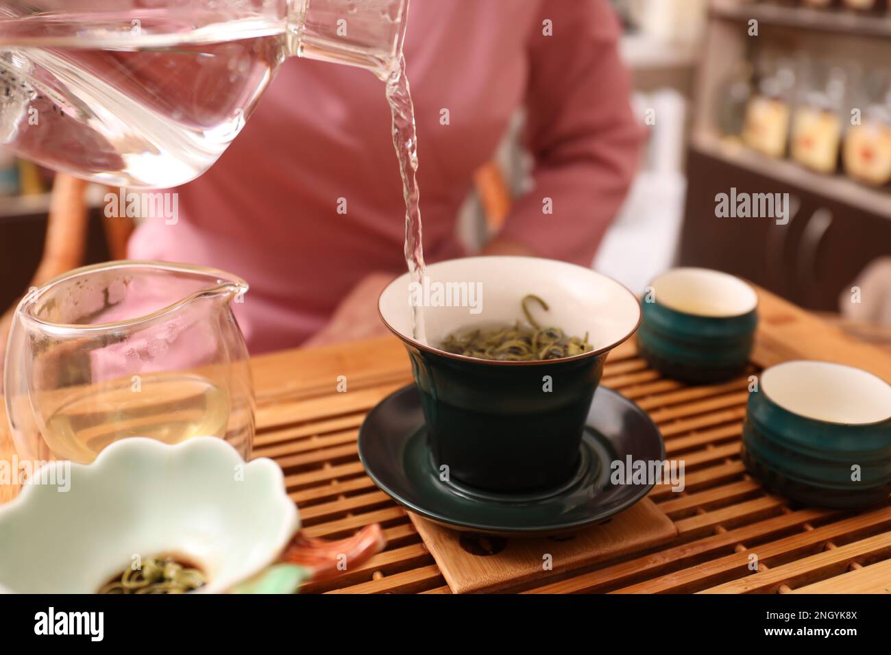 Master conducting traditional tea ceremony at table, closeup Stock ...
