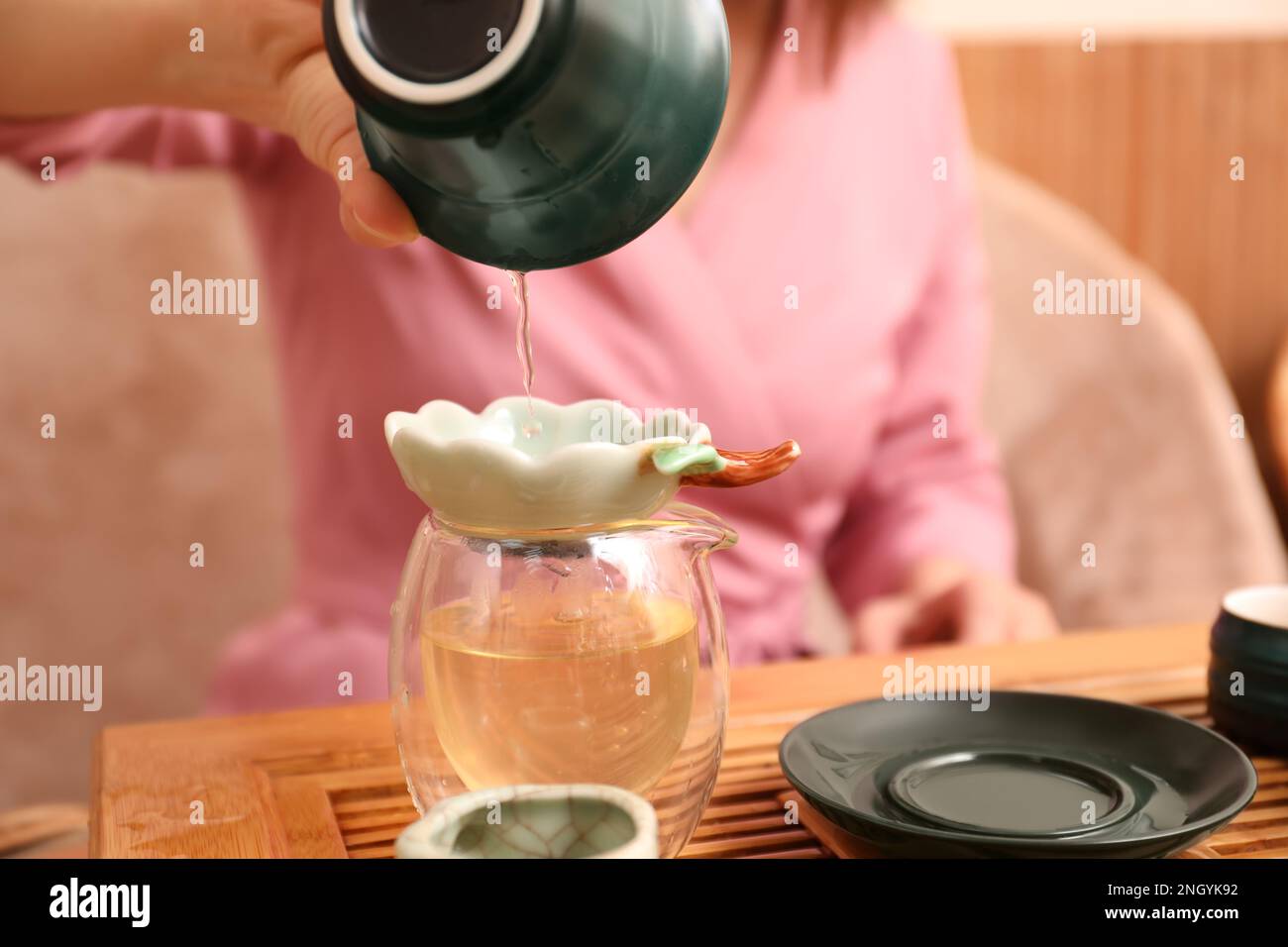 Master conducting traditional tea ceremony at table, closeup Stock ...