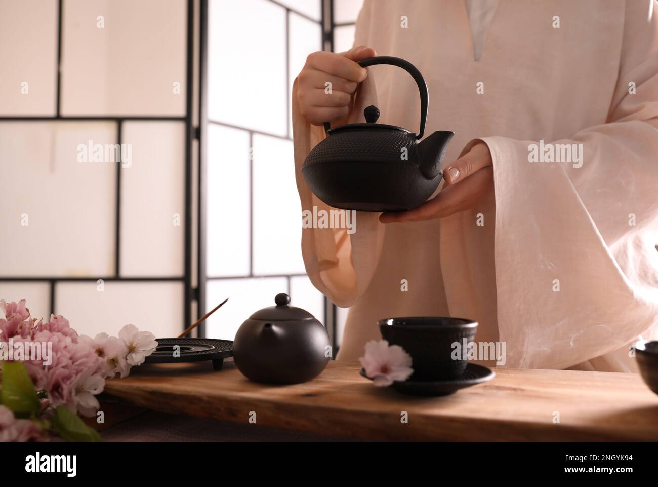 Master conducting traditional tea ceremony at table, closeup Stock ...