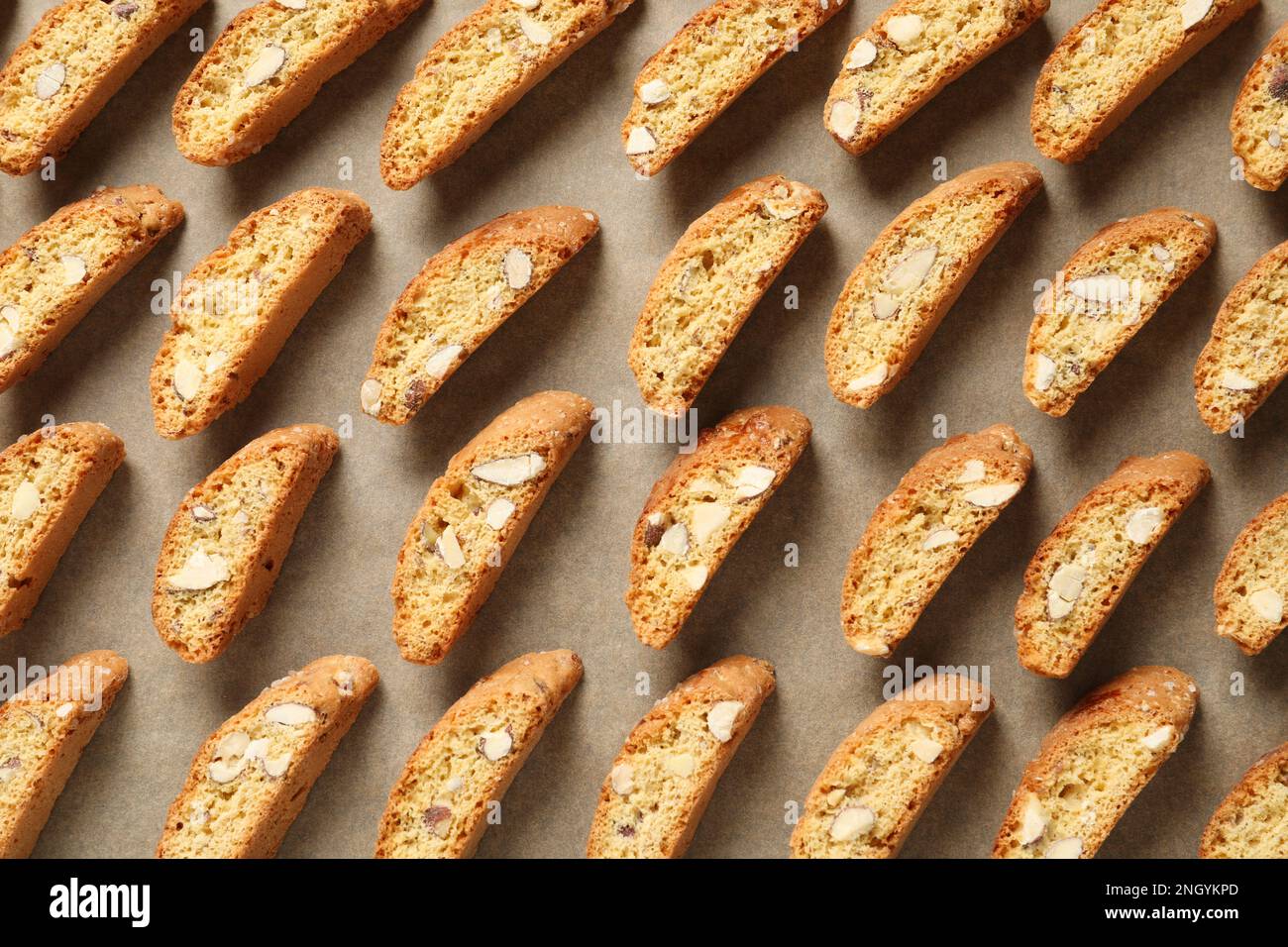 Traditional Italian almond biscuits (Cantucci) on parchment paper, flat ...