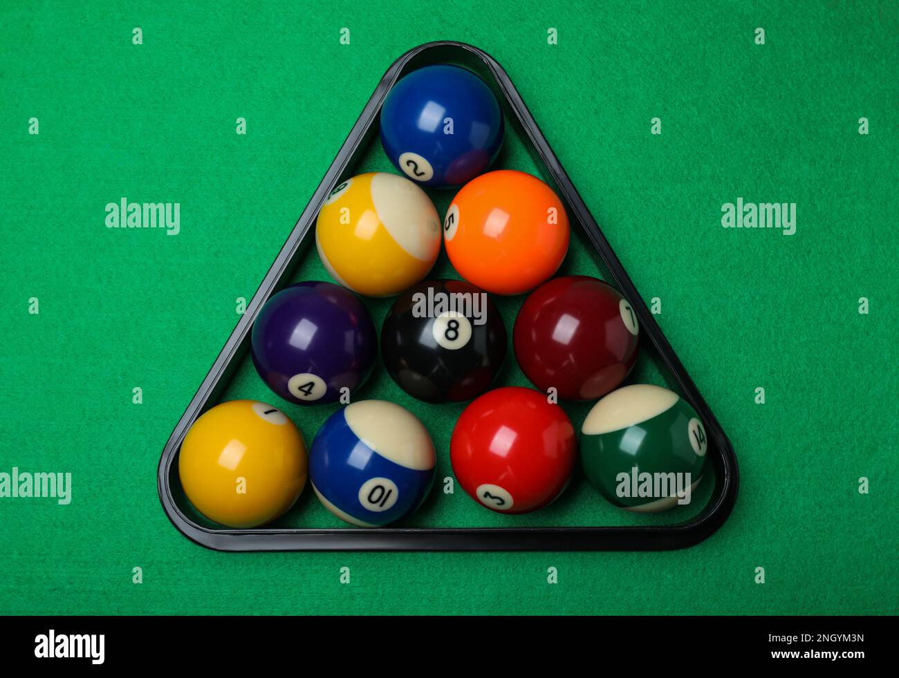 Plastic rack with billiard balls on green table, top view Stock Photo ...