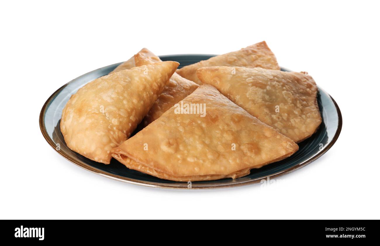Fresh delicious crispy samosas on white background Stock Photo - Alamy