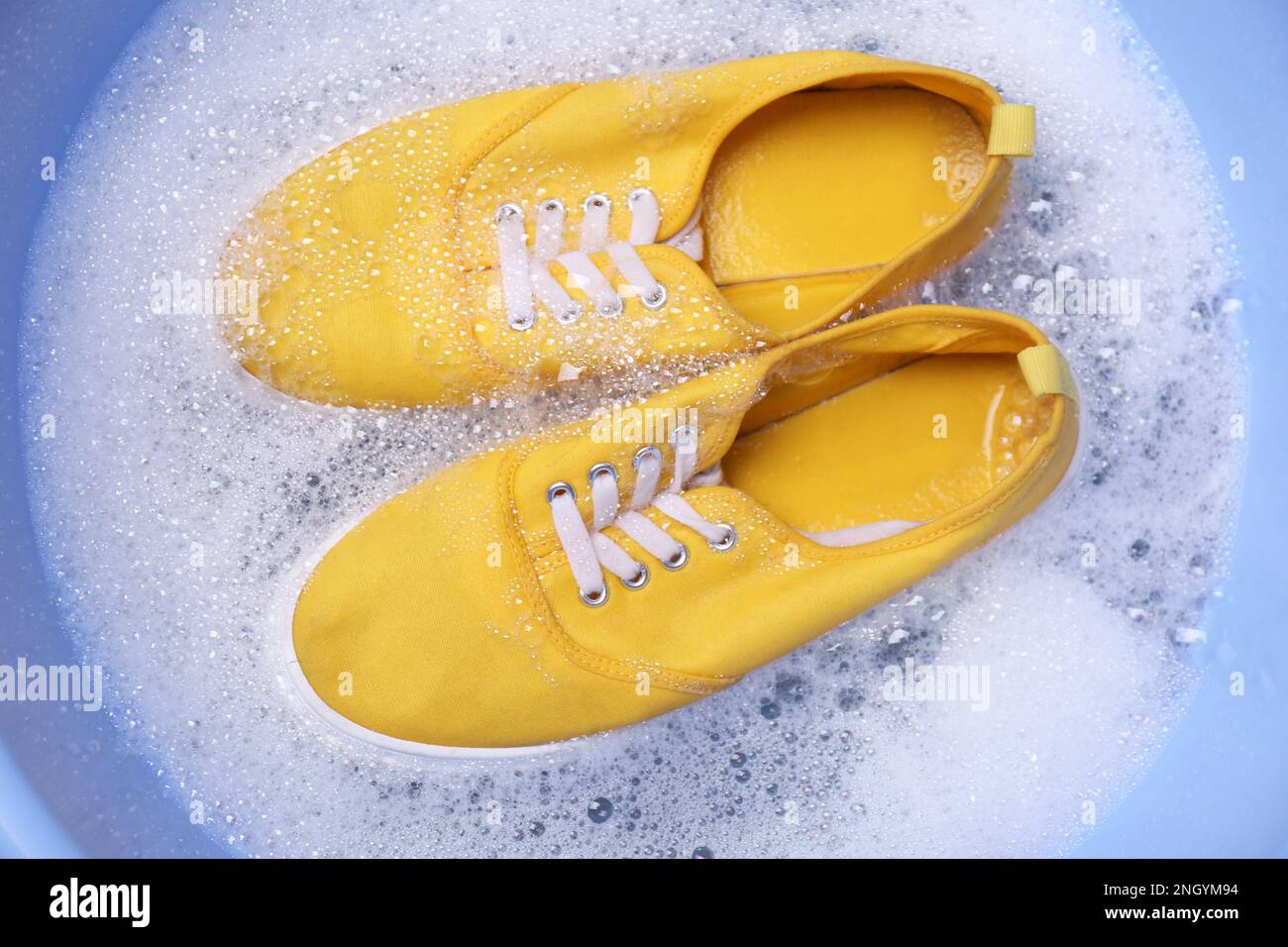 Washing sport shoes in plastic basin, top view Stock Photo - Alamy