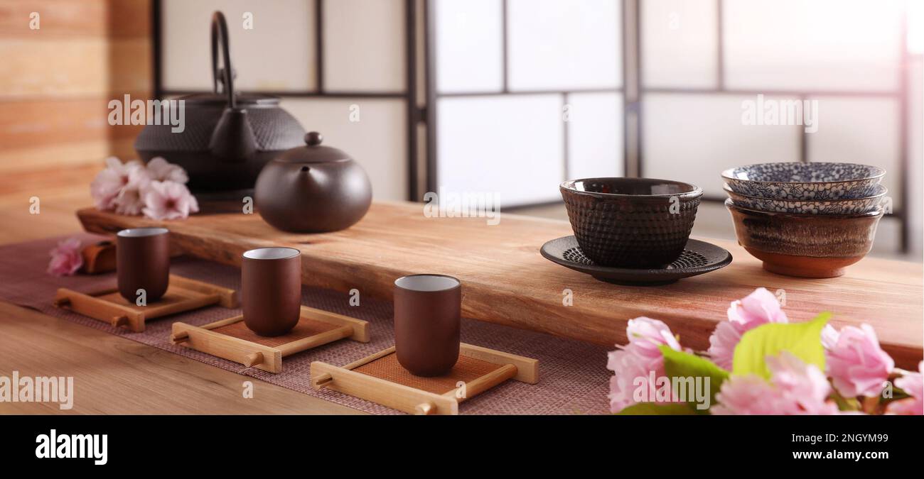 Beautiful set for traditional tea ceremony and sakura flowers on wooden ...