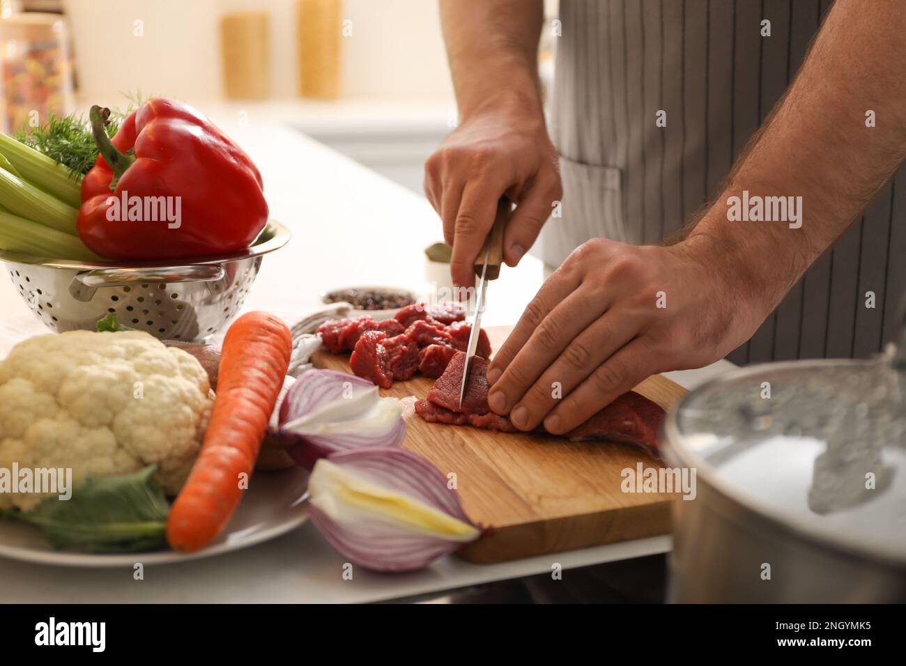 Man cutting meat hi-res stock photography and images - Alamy