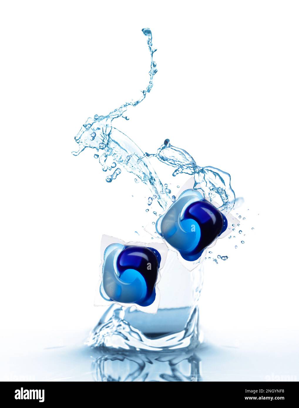 Laundry capsules falling into water on white background. Detergent pods ...