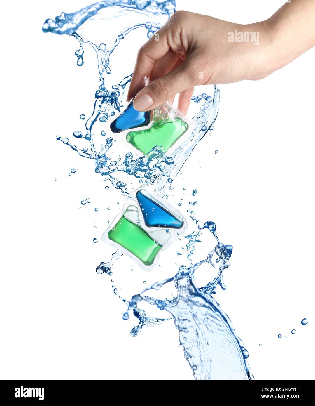 Splashes of water and woman holding laundry capsule on white background ...