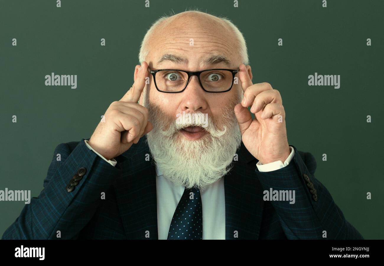 Surprised professor in empty lecture classroom. Education and knowledge ...