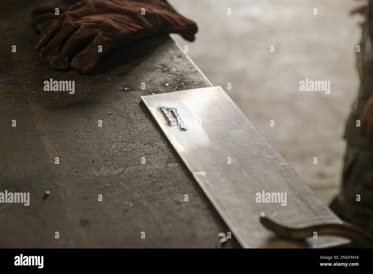 Weld metal and base metal rest fused on a table inside of the 783rd SMC ...