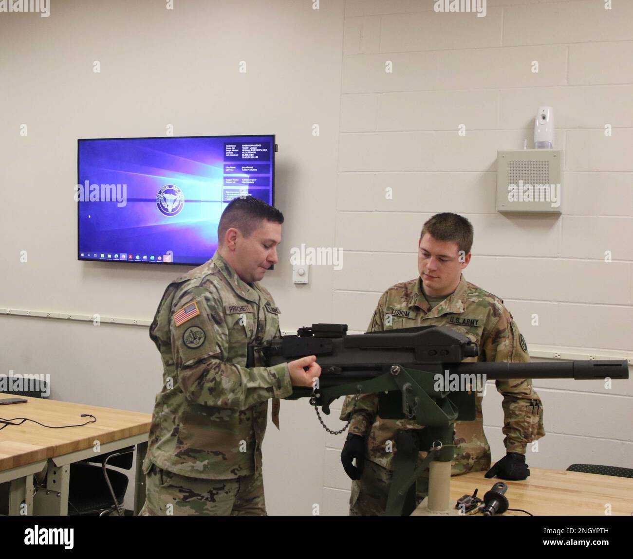 Staff Sgt. Luke Prichett performs a functions check on the Mark 19 ...