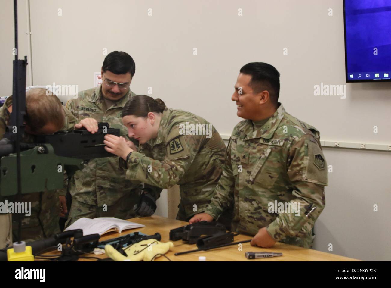Spc. Emma Burbridge and her table mates work through reassembling the ...