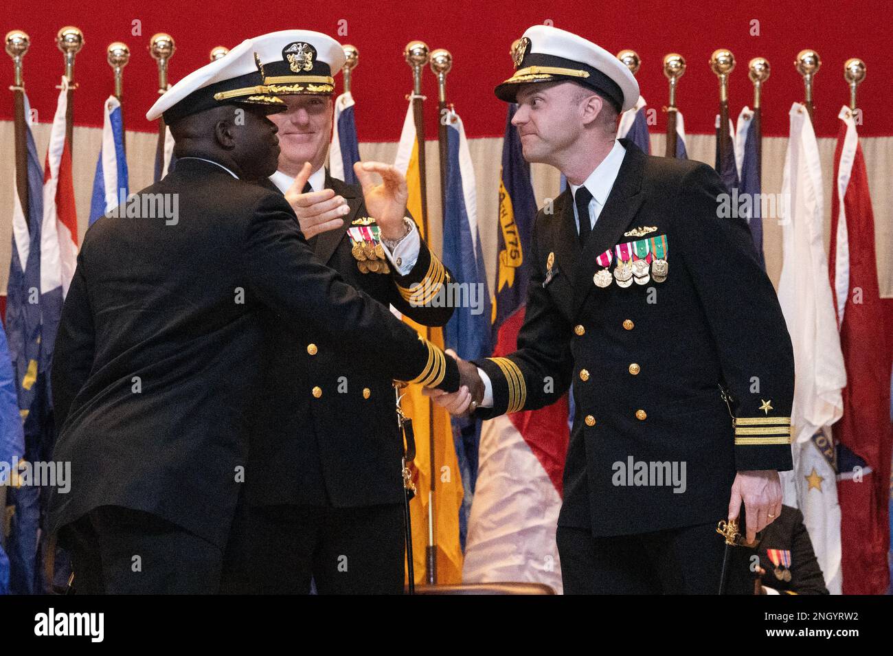 Cmdr. Nicholas Meyers, right, shakes hands with Cmdr. Randall Leslie ...