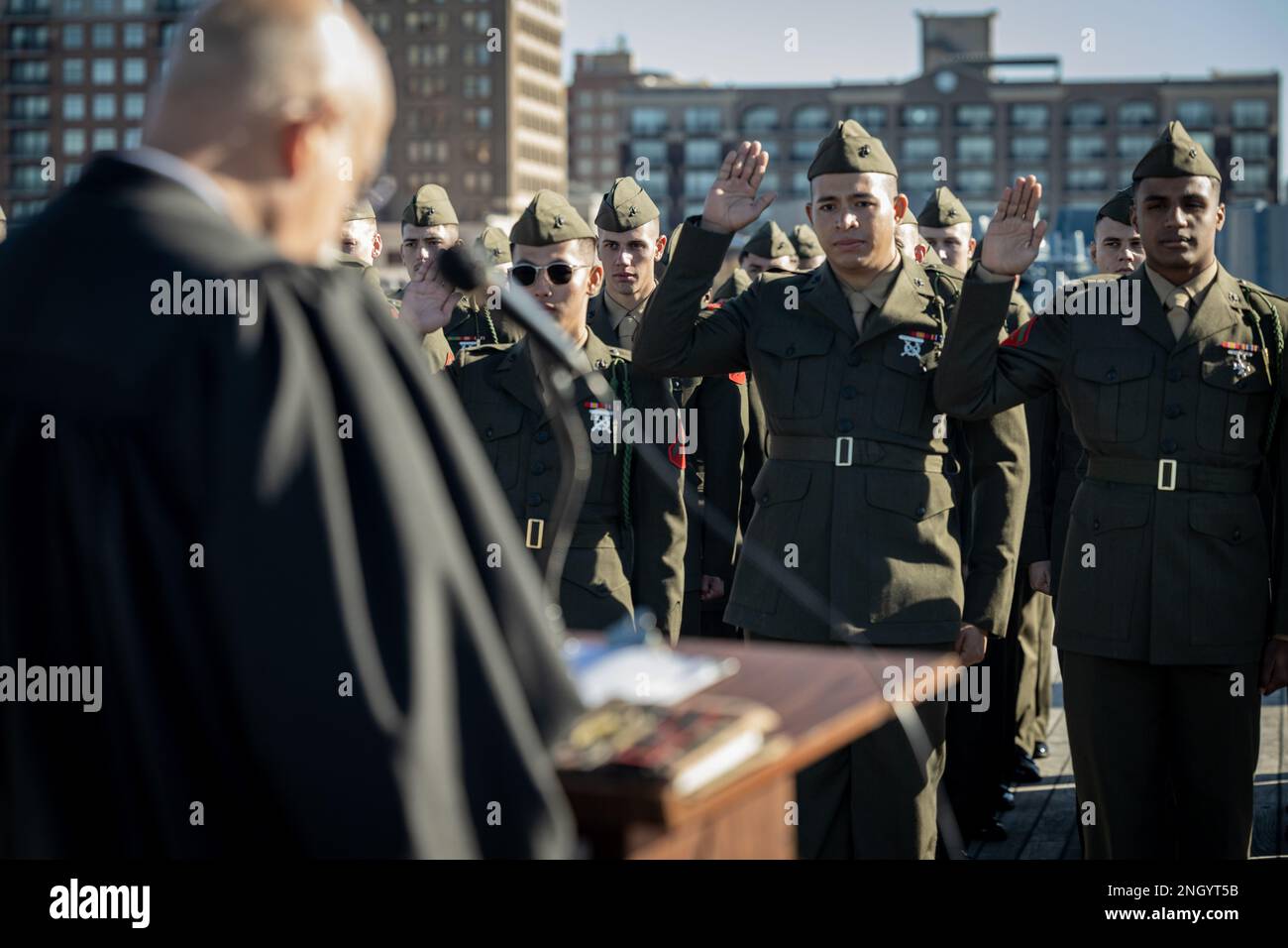 U.S. Marines from 1st Battalion, 8th Marine Regiment, raise their right ...