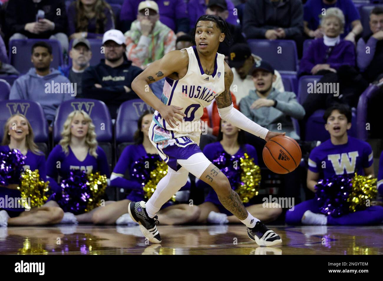 Washington guard Koren Johnson brings the ball downcourt against Oregon ...