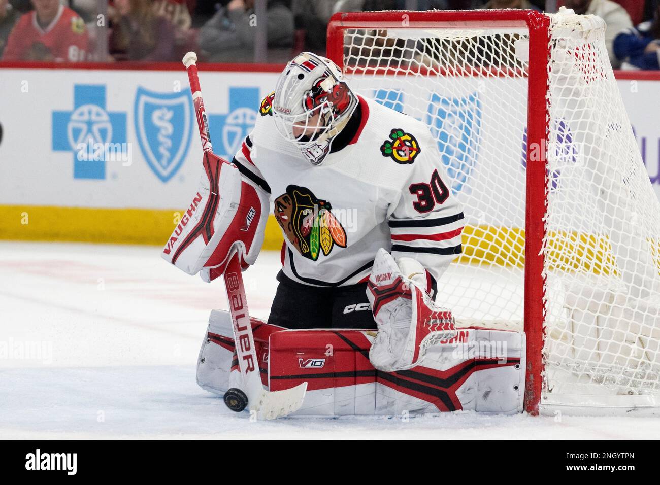Chicago Blackhawks goaltender Jaxson Stauber stops a shot during the ...