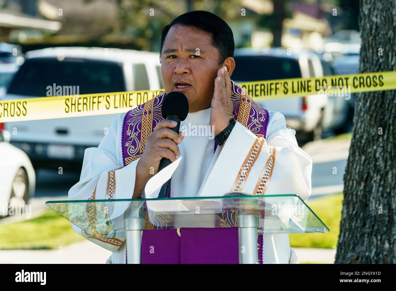 Rev. Albert Avenido holds his hands on his cheek, as he quotes the ...
