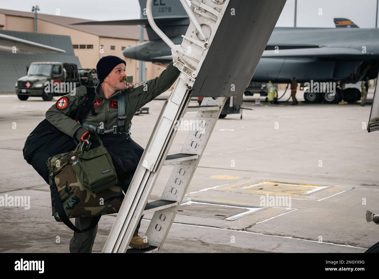 A Weapons Systems Officer, assigned to the 34th Bomb Squadron, boards a ...