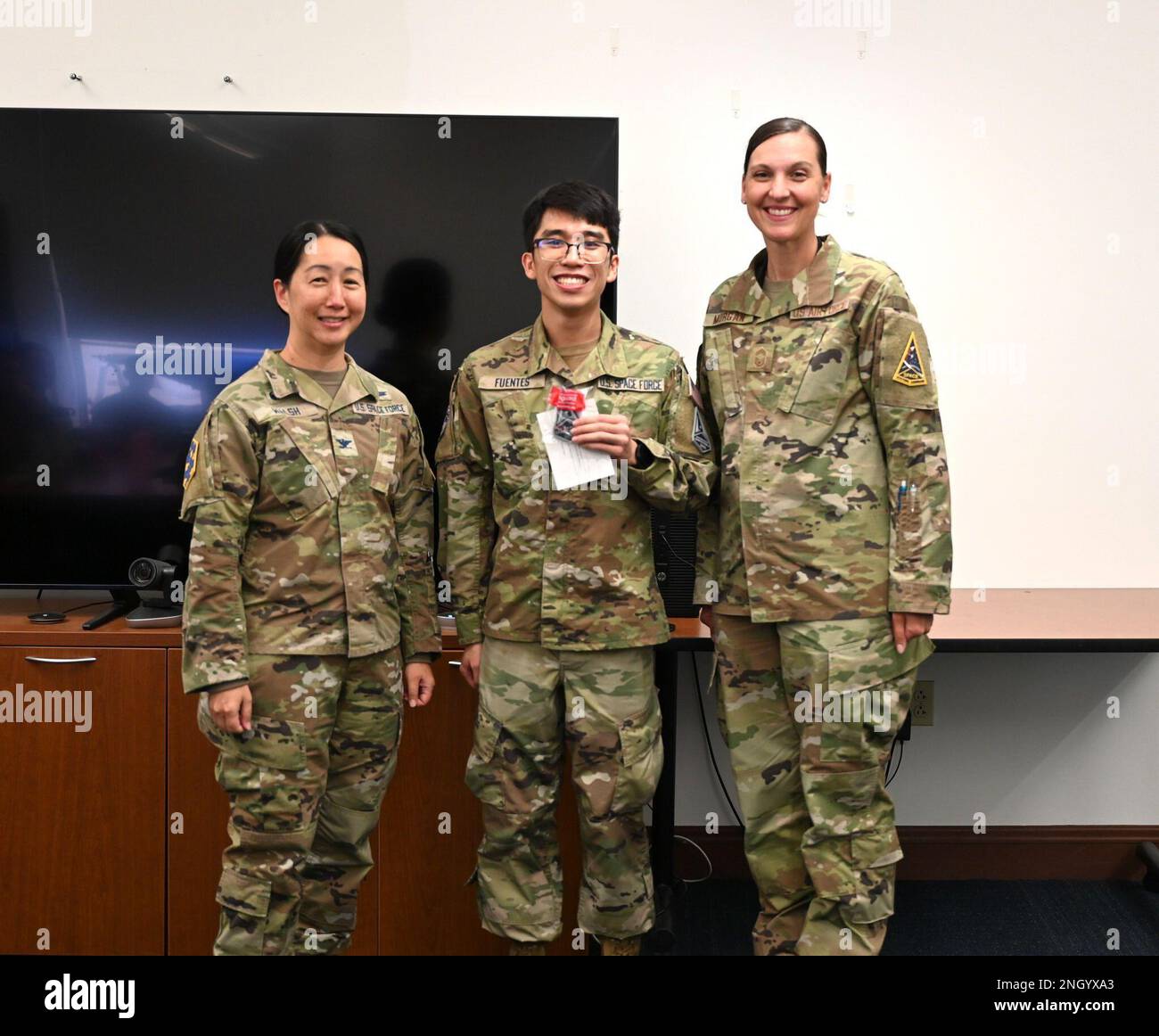 Cadet Fuentes poses for a picture with SBD 3 Commander, Col. Mia Walsh ...