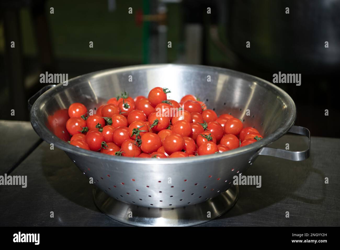 A bowl of tomatoes sits during dinner preparation for participants of ...