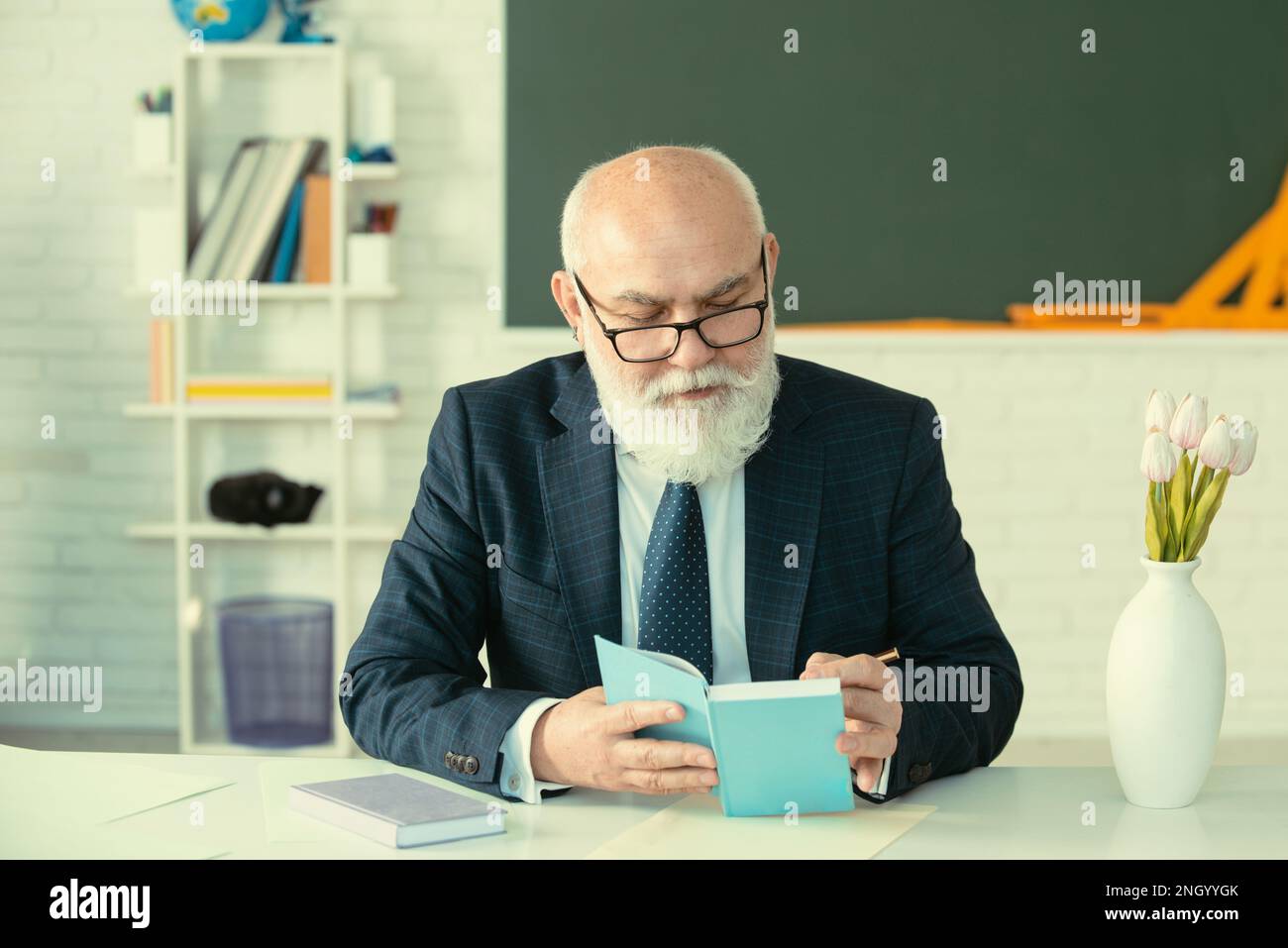Senior professor at school. Man teacher with beard in class Stock Photo ...