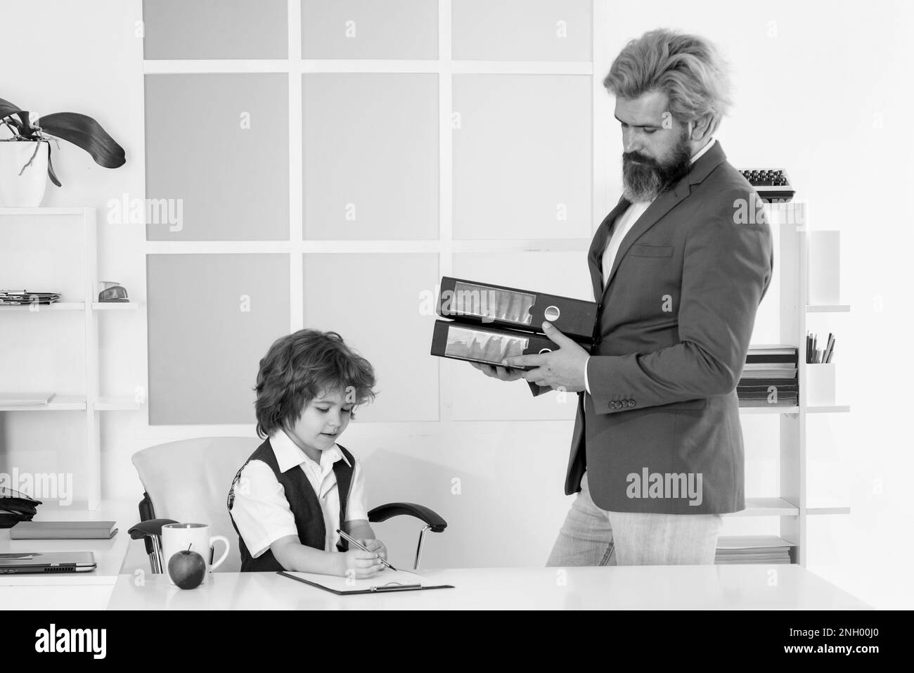 Business partners little child businessman and his older mentor. Father ...