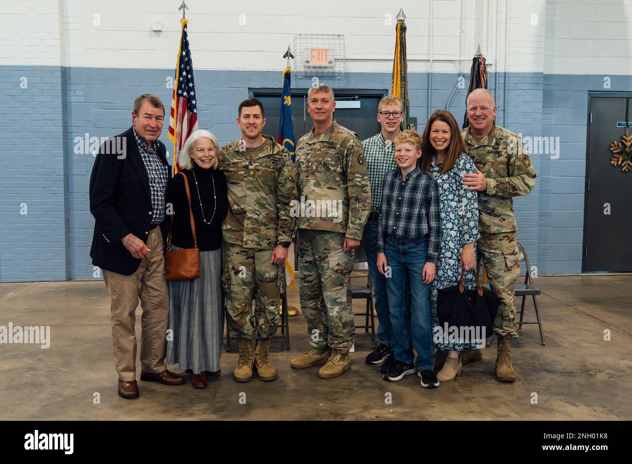 U.S. Army Maj. Andrew DeLaney, center left, poses with family and ...