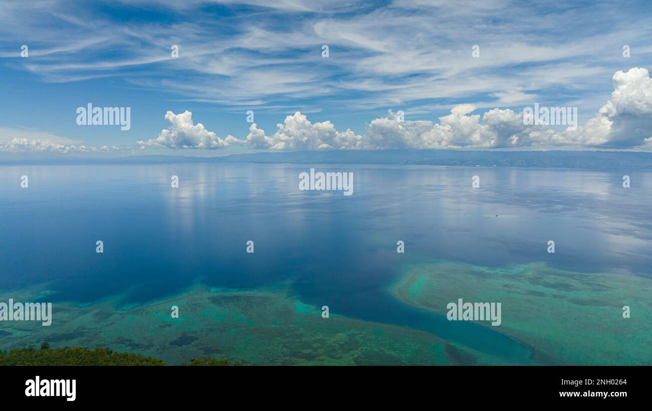 Aerial drone of the island of Cebu from the sea. Blue ocean and sky ...