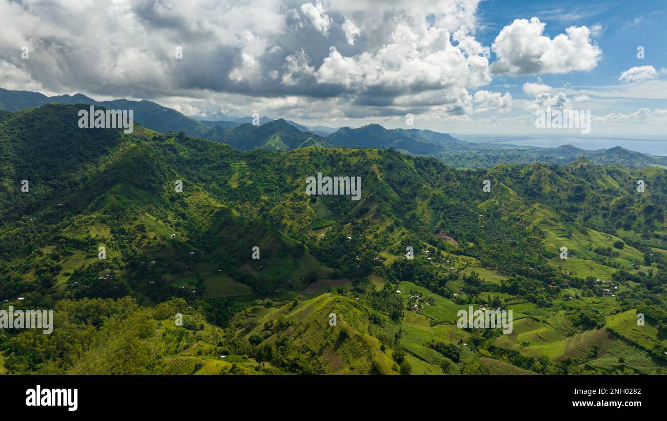 Aerial view of mountain landscape with green hills and farmland. Negros ...