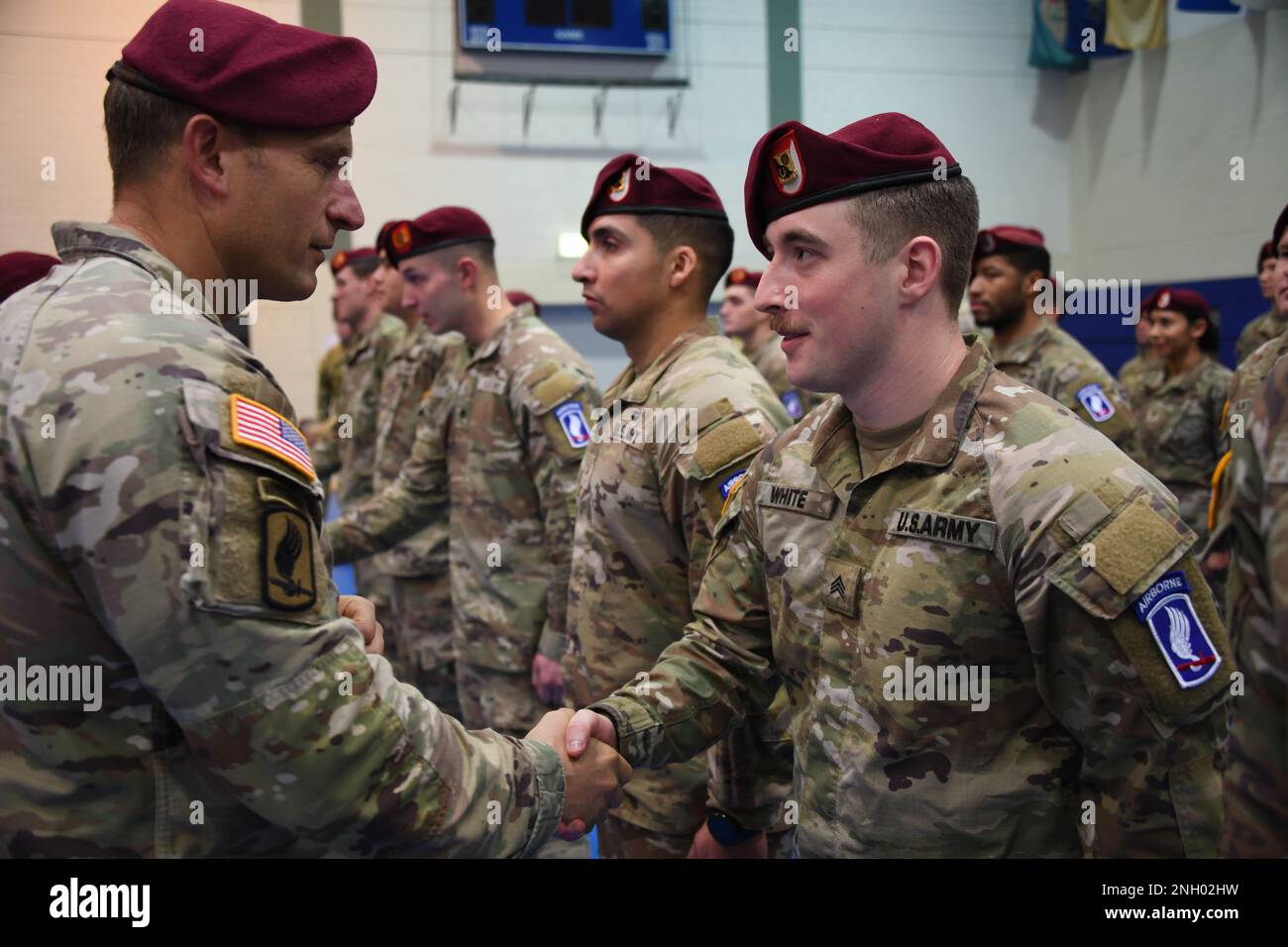 U.S. Army Col. Michael Kloepper, Commander of 173rd Airborne Brigade, shakes hands with ...