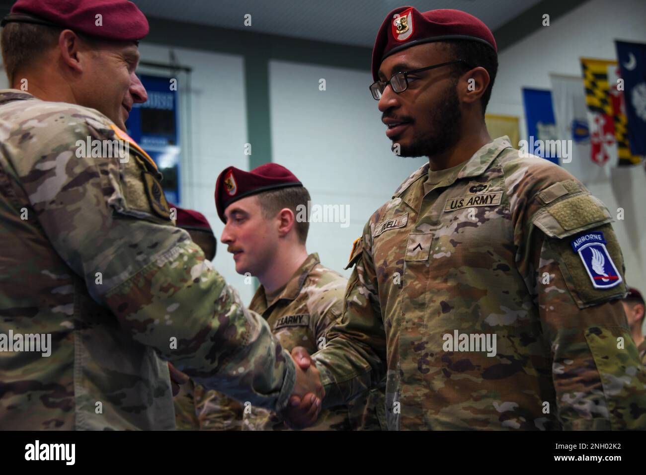 U.S. Army Col. Michael Kloepper, Commander of 173rd Airborne Brigade, shakes hands with ...