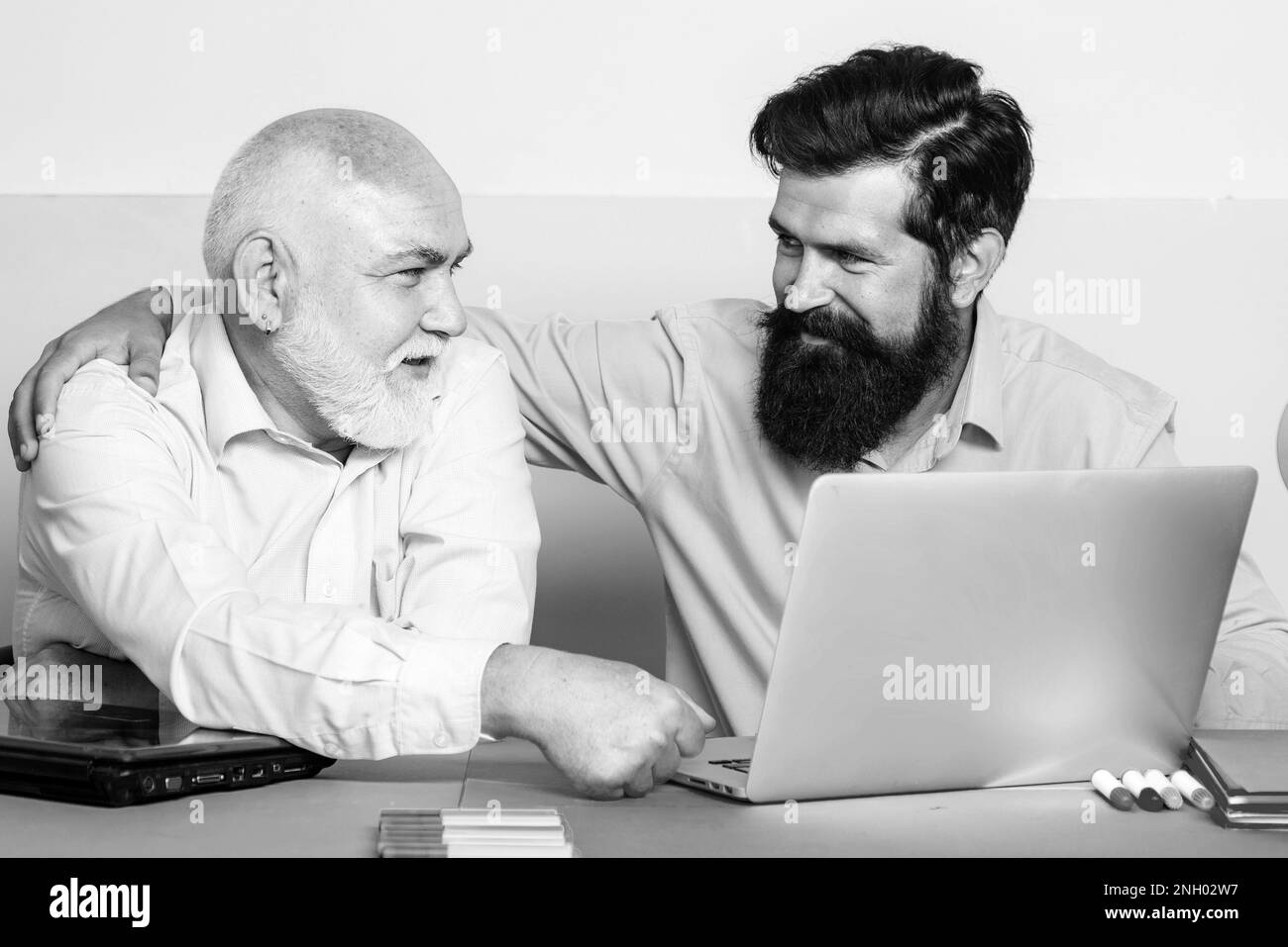 Business people having meeting around table in modern color office ...