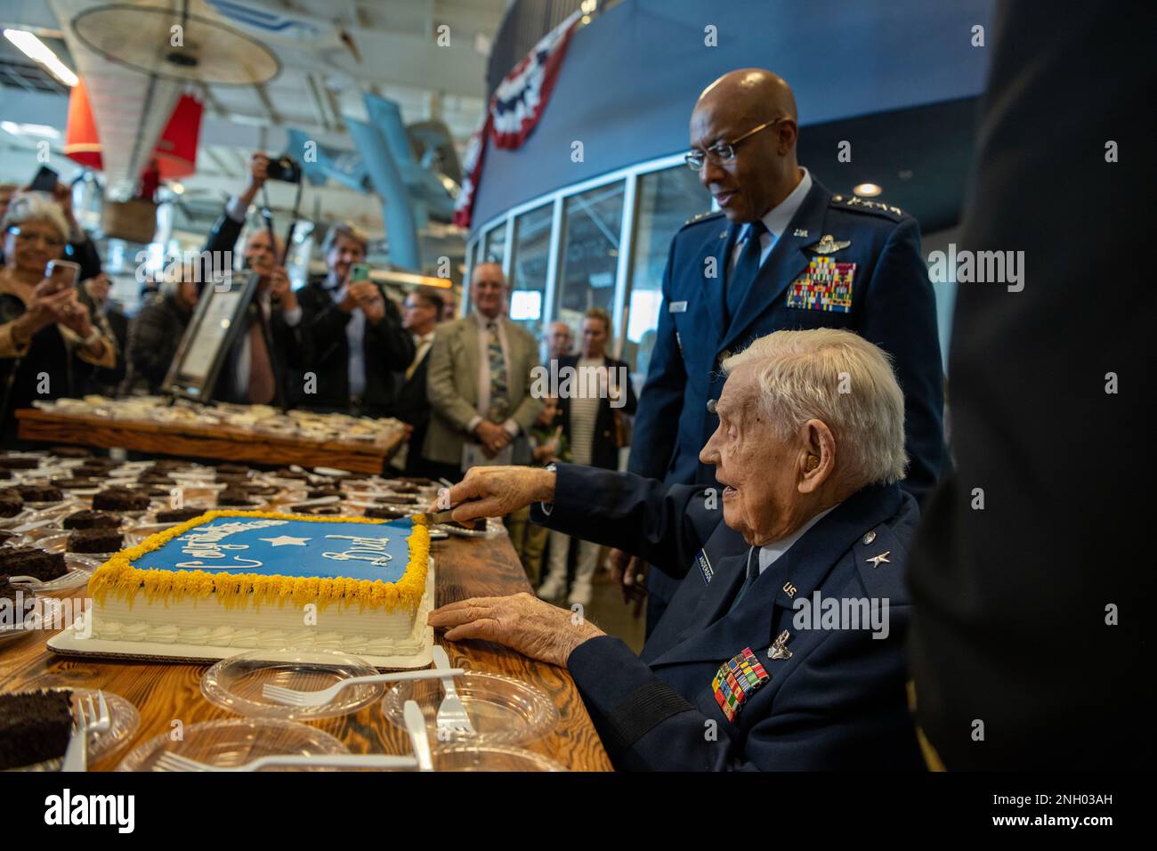 Air Force retired Brig. Gen. Clarence E. “Bud” Anderson cuts a ...