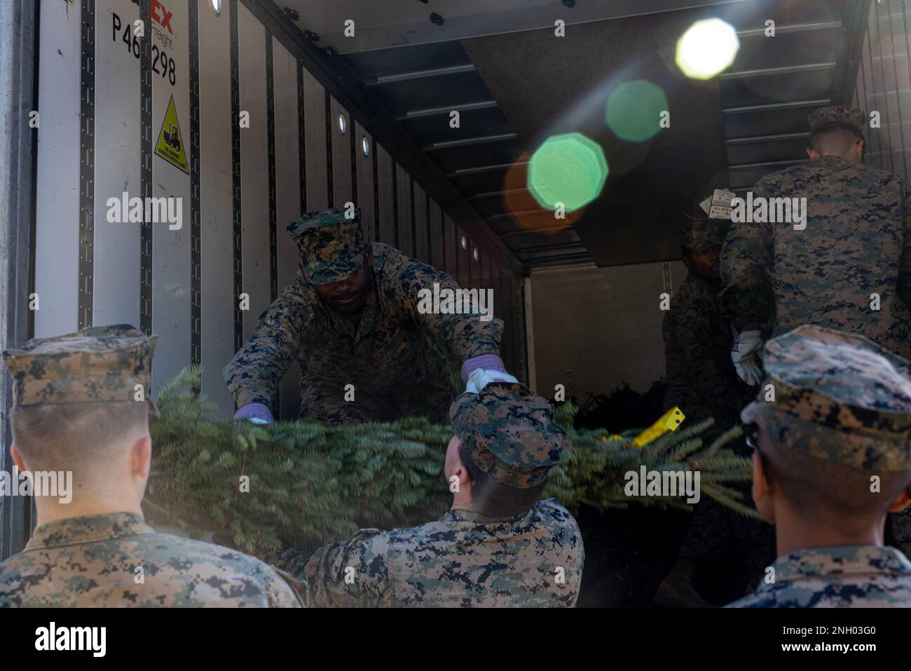 U.S. Marine Corps Lance Cpl. Lance Cpl. Joshua Henry, top left, an ...