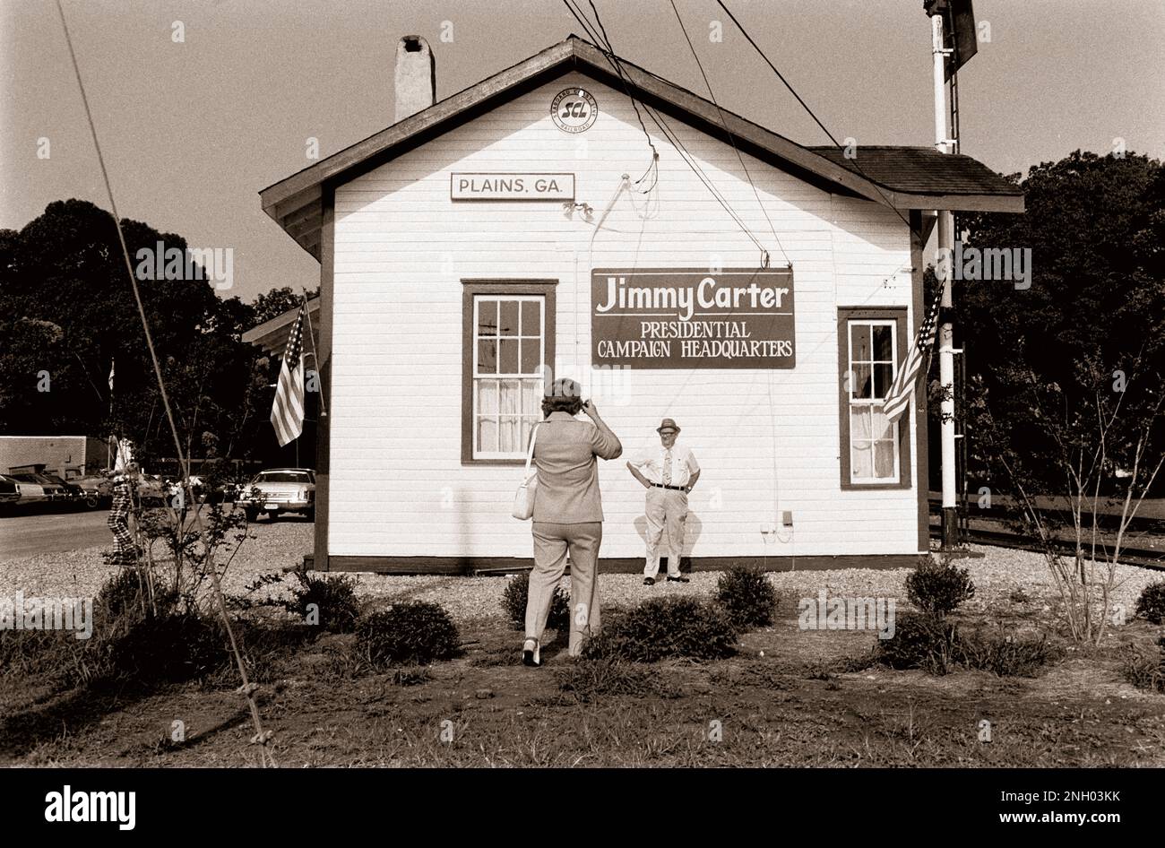 A tourist and supporter of Jimmy Carter takes a snapshot of her husband ...