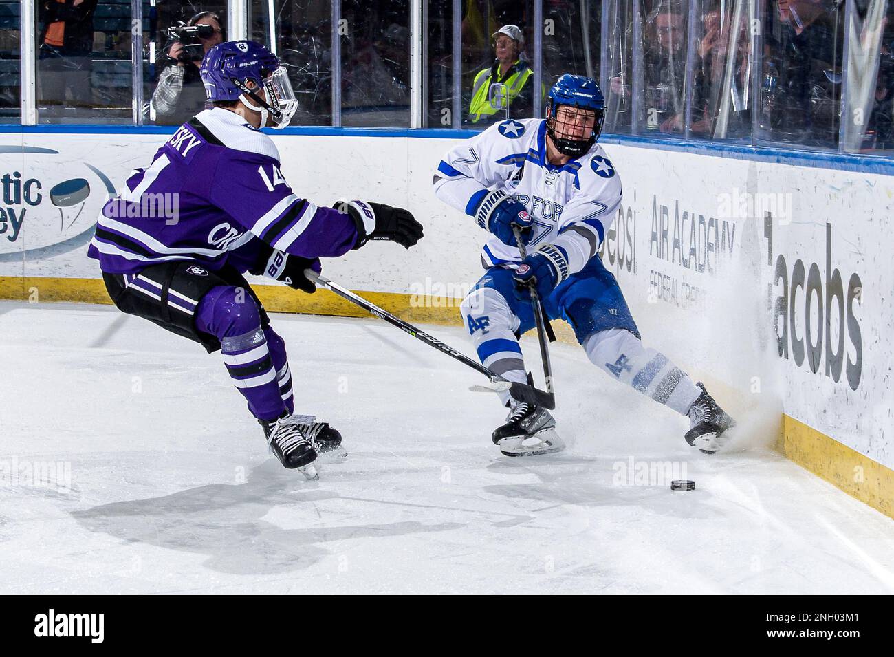U.S. Air Force Academy -- Air Force's Brian Adams plays the puck before ...