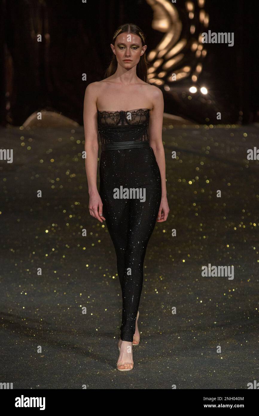 London, UK. 19th Feb, 2023. A model walks the runway at the Autumn ...