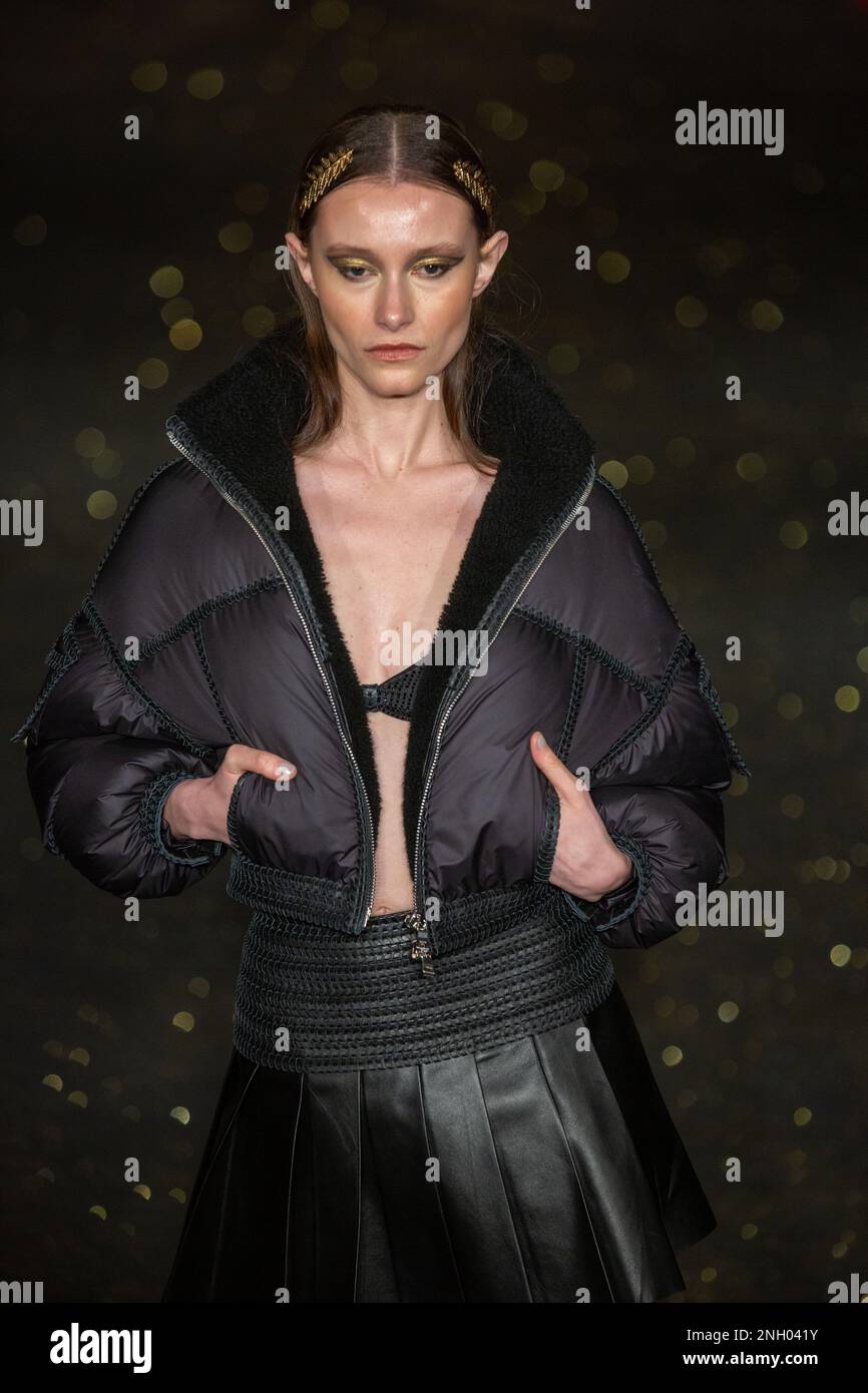 London, UK. 19th Feb, 2023. A model walks the runway at the Autumn ...