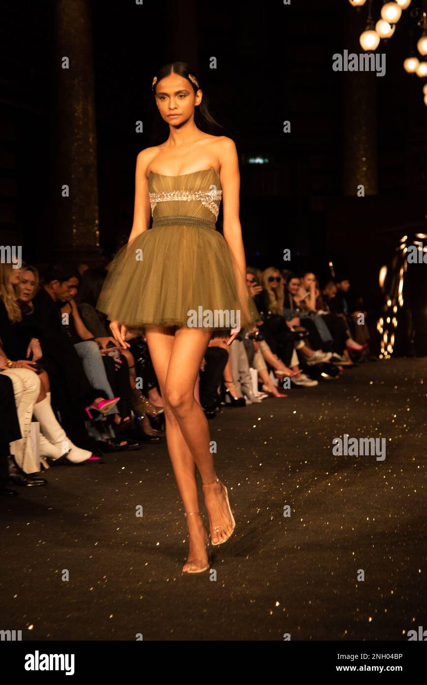 London, UK. 19th Feb, 2023. A model walks the runway at the Autumn ...