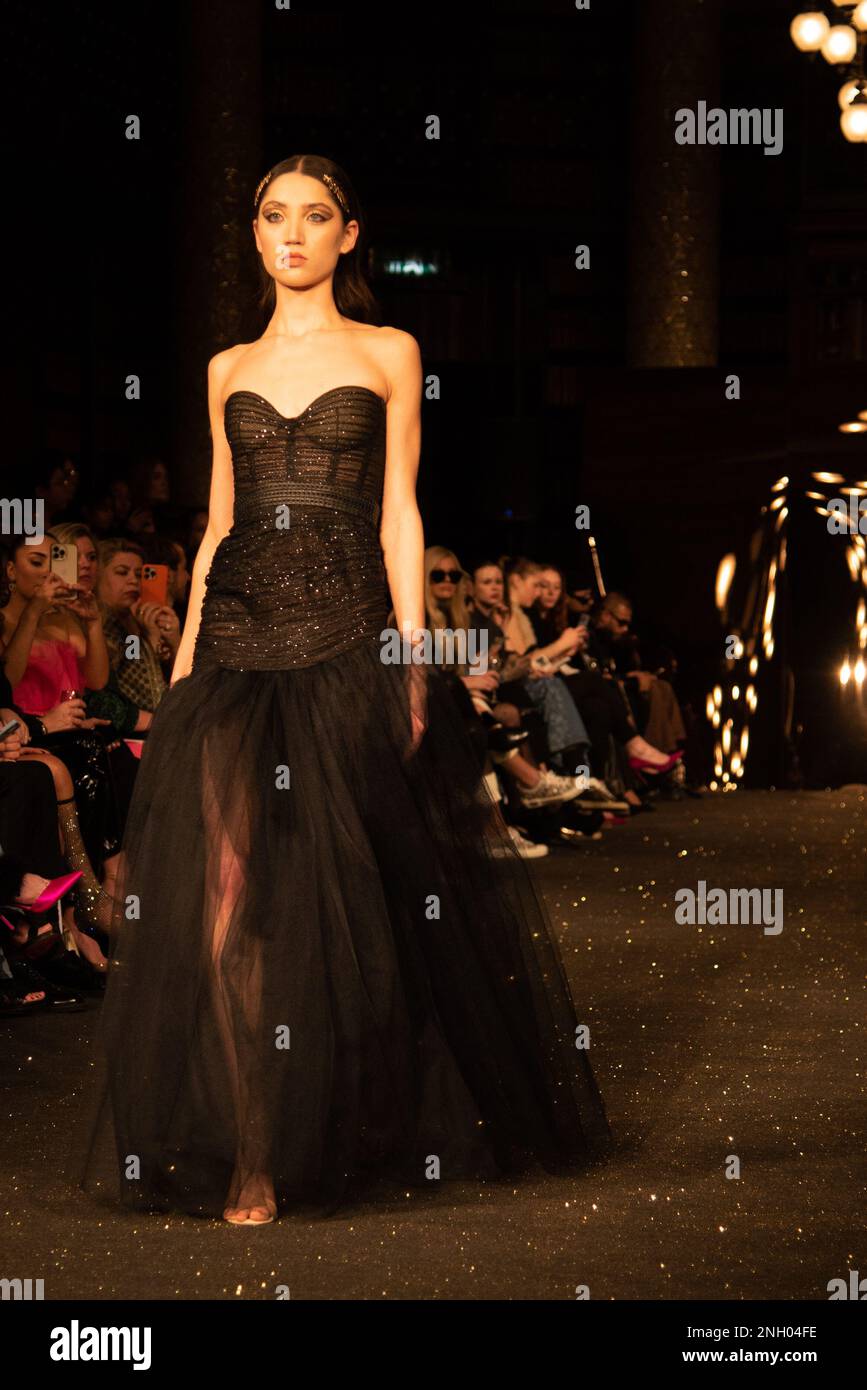 London, UK. 19th Feb, 2023. A model walks the runway at the Autumn ...