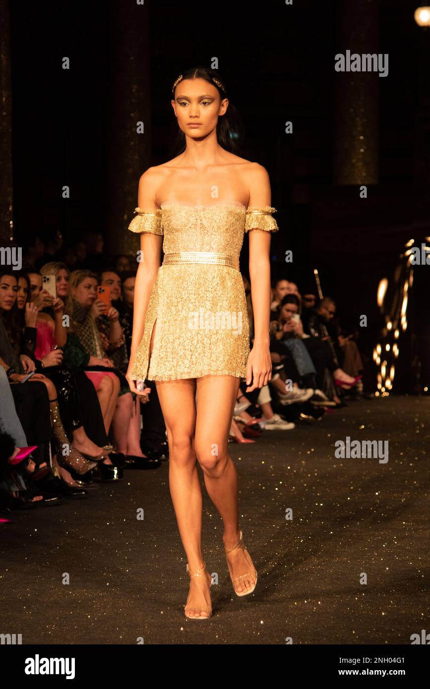 London, UK. 19th Feb, 2023. A model walks the runway at the Autumn ...