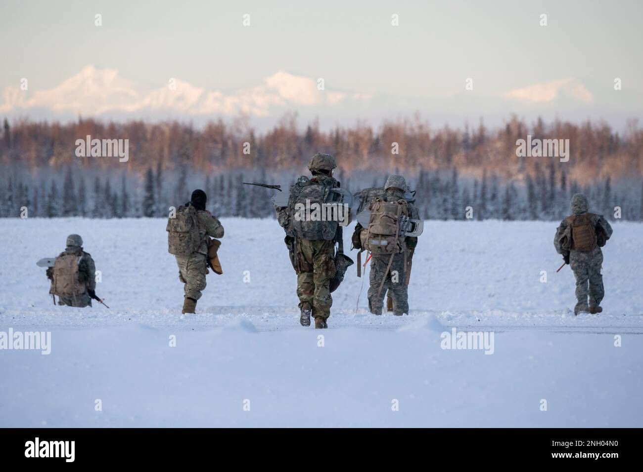 University of Alaska Army ROTC cadets proceed to their objective after ...