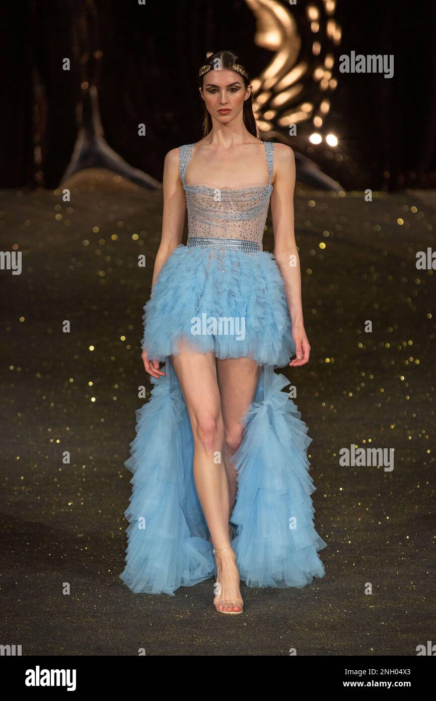 London, UK. 19th Feb, 2023. A model walks the runway at the Autumn ...