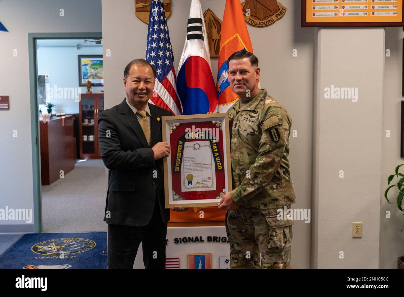 CSM Jay A. High (Right) posing in a photo with Grandmaster Kim (Left ...