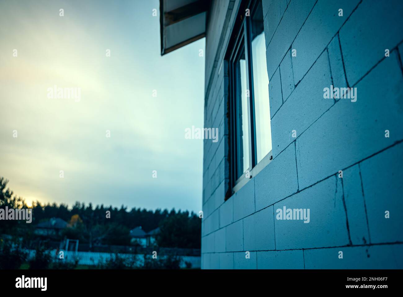 An angle shot of a freshly built private house made of aerated concrete ...