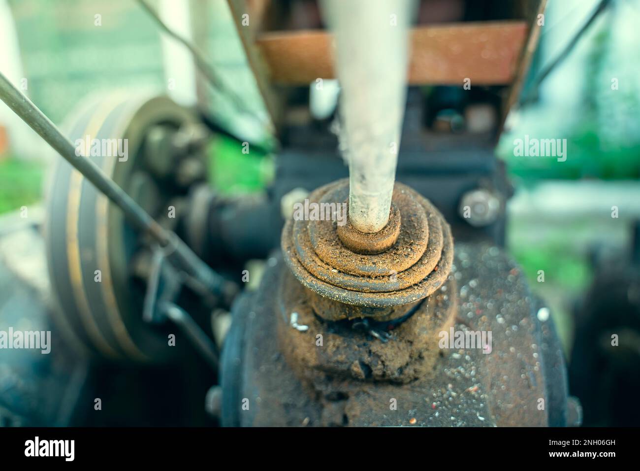 Gear lever on a walk-behind tractor close-up on a blurred background ...