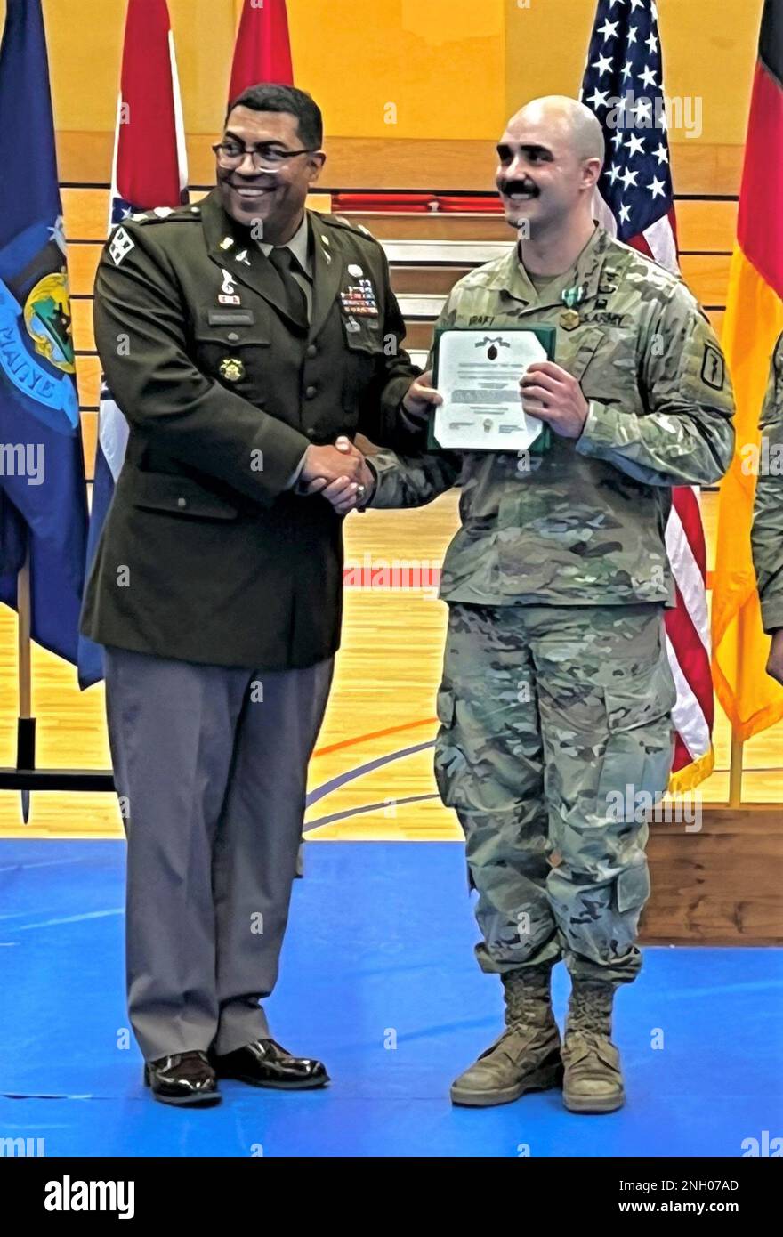 Col. Jordan Henderson, commander of 30th Medical Brigade, congratulates ...