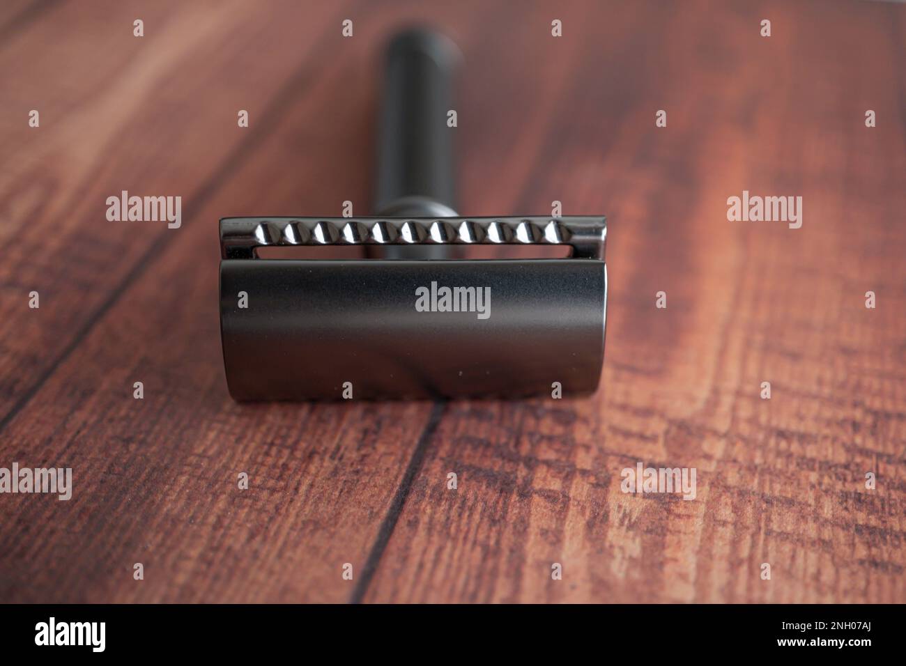 Safety razor on a wood table background Stock Photo - Alamy