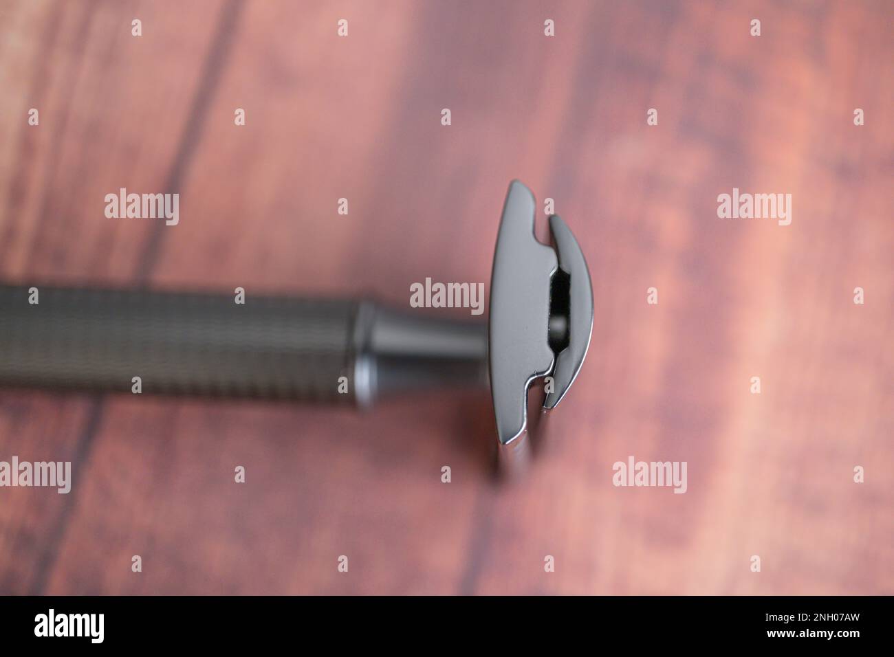 Safety razor on a wood table background Stock Photo - Alamy